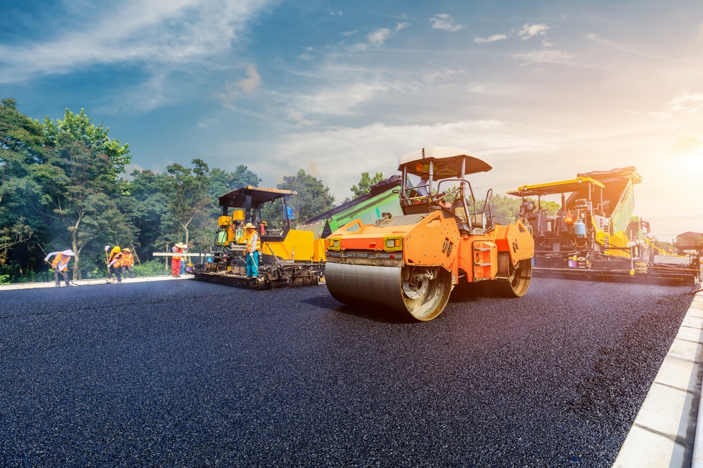 Construction,Site,Is,Laying,New,Asphalt,Pavement,,Road,Construction,Workers